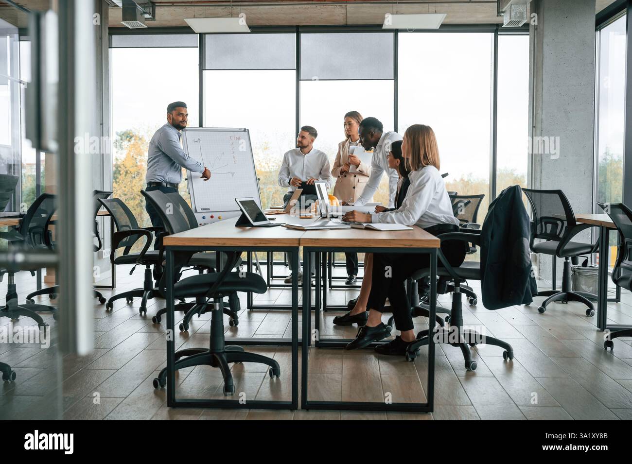 Business strategy on the whiteboard. Group of office workers are together indoors Stock Photo ...