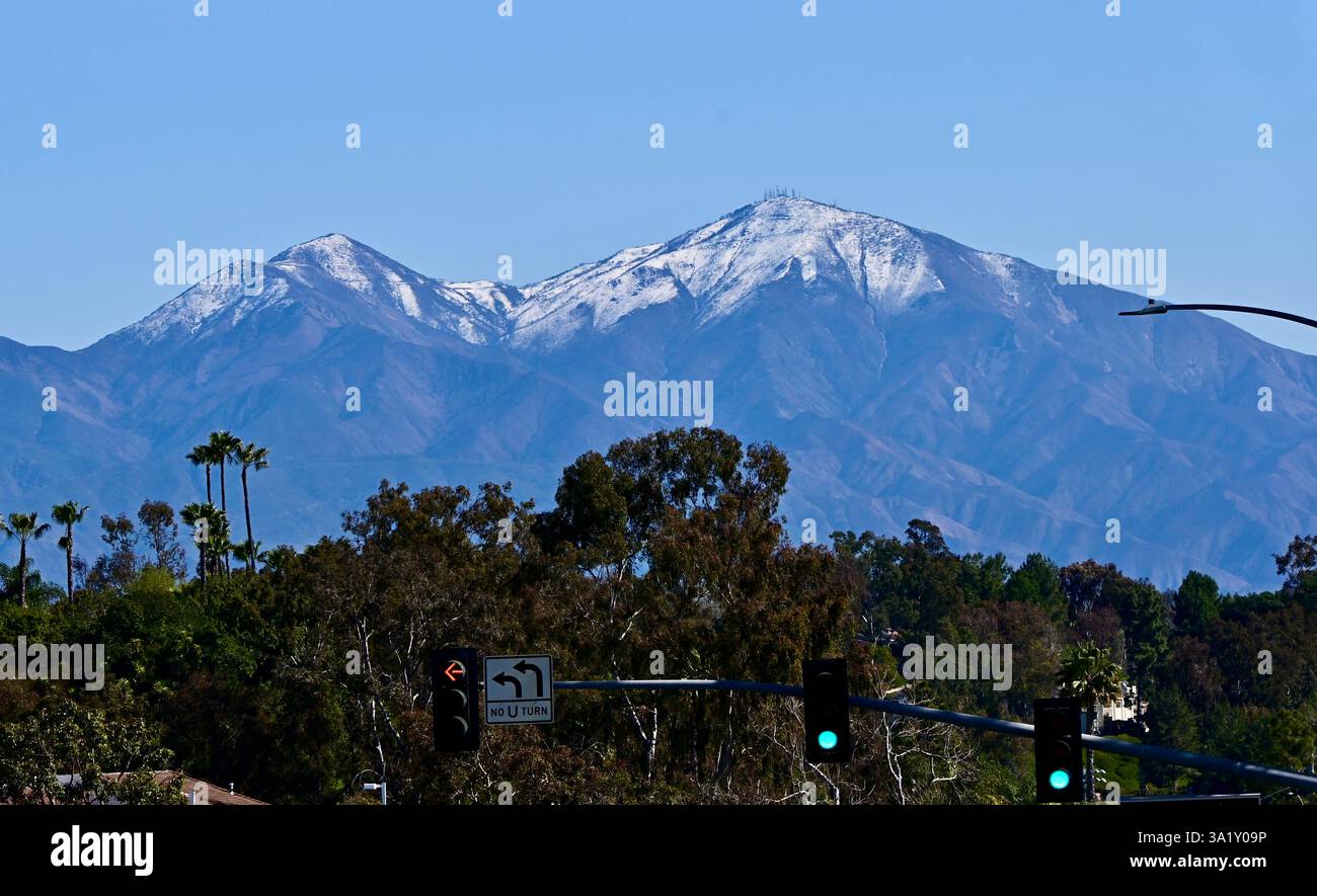 Santiago peak in Santa Ana mountains with winter snow, palm trees ...