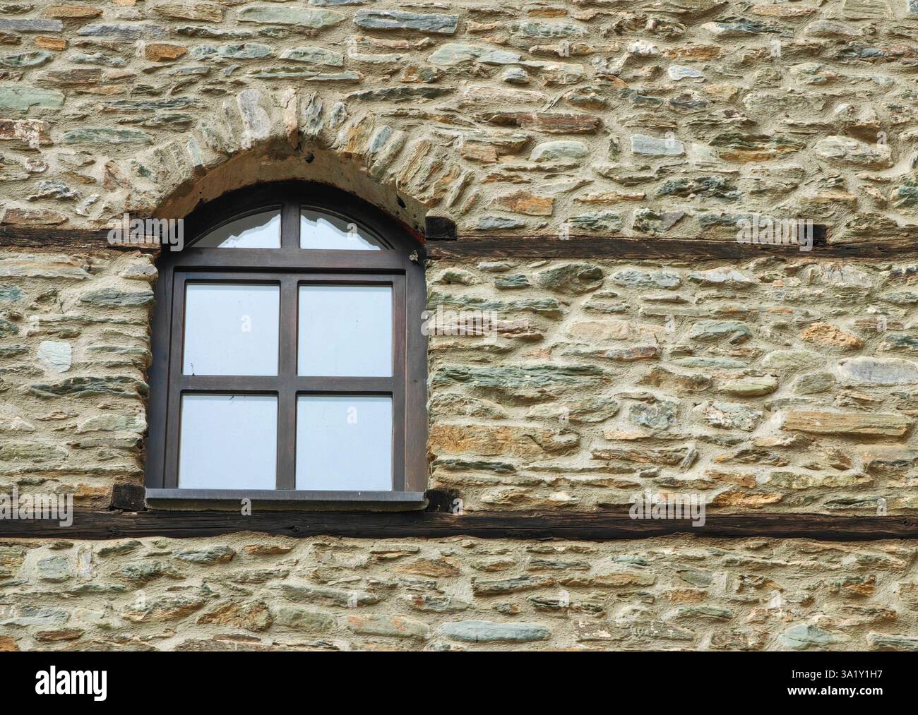 Timeless Heritage – Arch Wooden Window & Stone Wall Stock Photo - Alamy