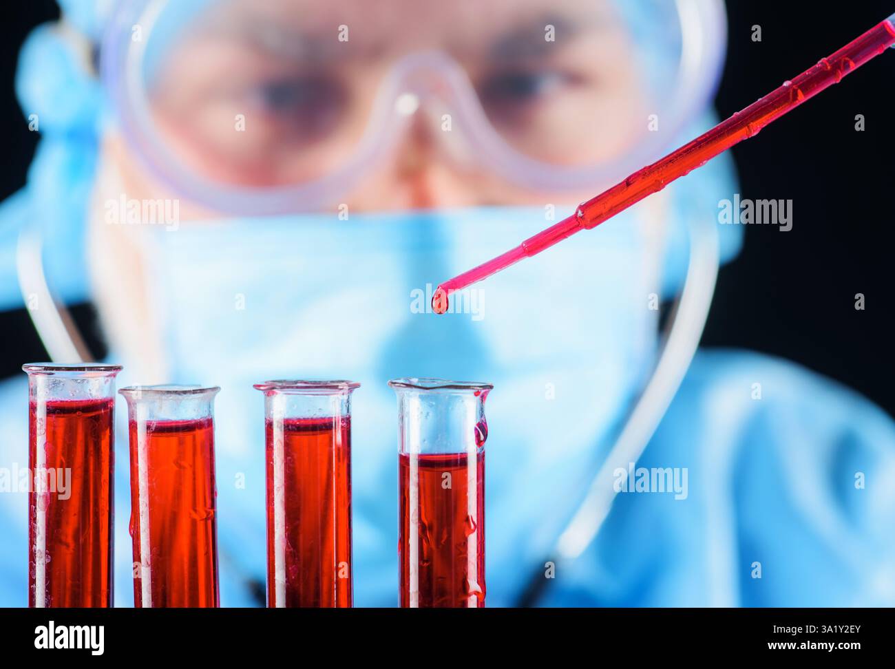 Blood test. Doctor works with patient's blood sample in lab. Drop of ...