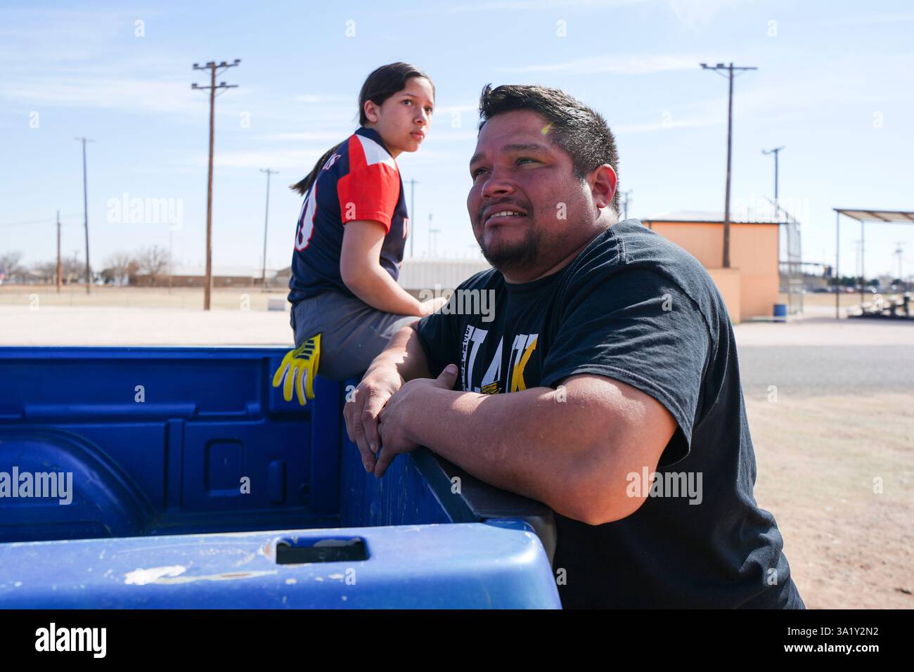 Matthew Ontiveros, right, stands near his truck with his daughter ...