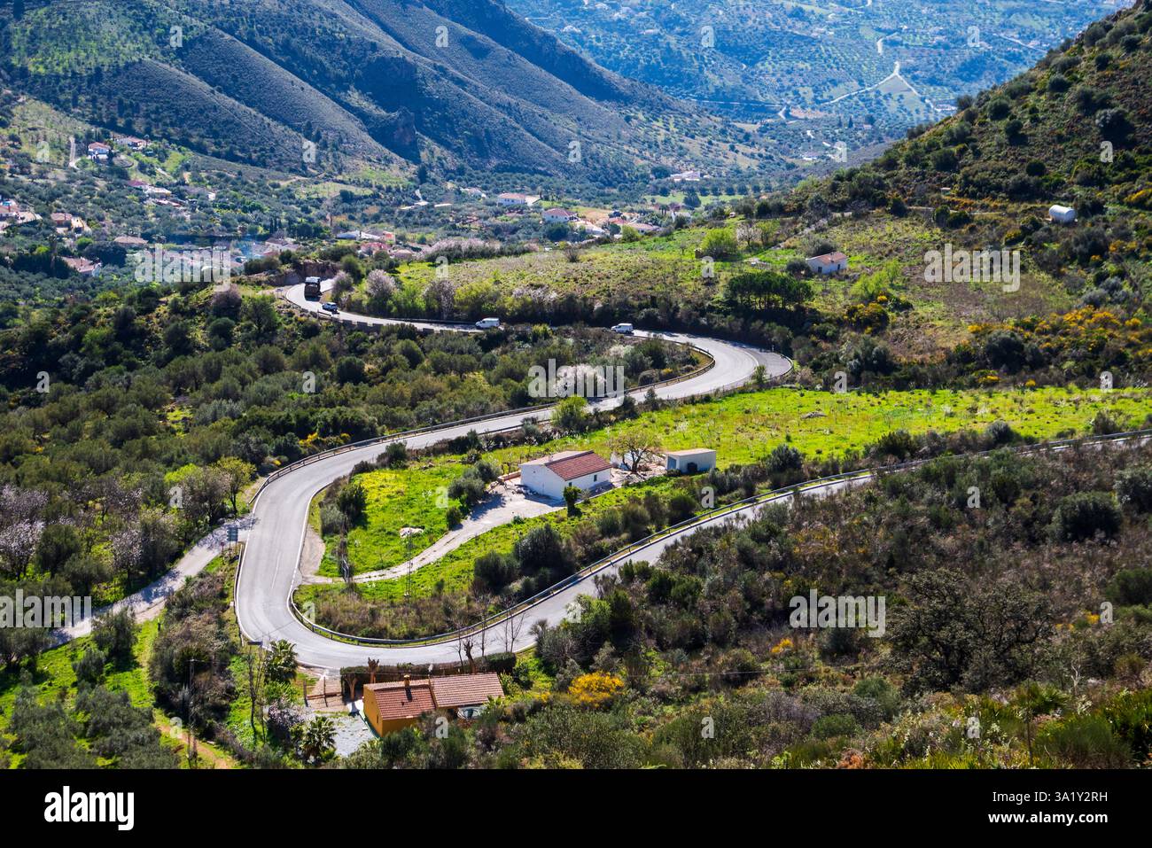 Mountain road with a slope and sharp, dangerous curves in Ventas de ...