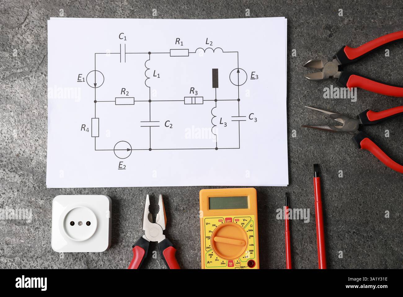Different electrical tools and circuit diagram on grey table, flat lay ...
