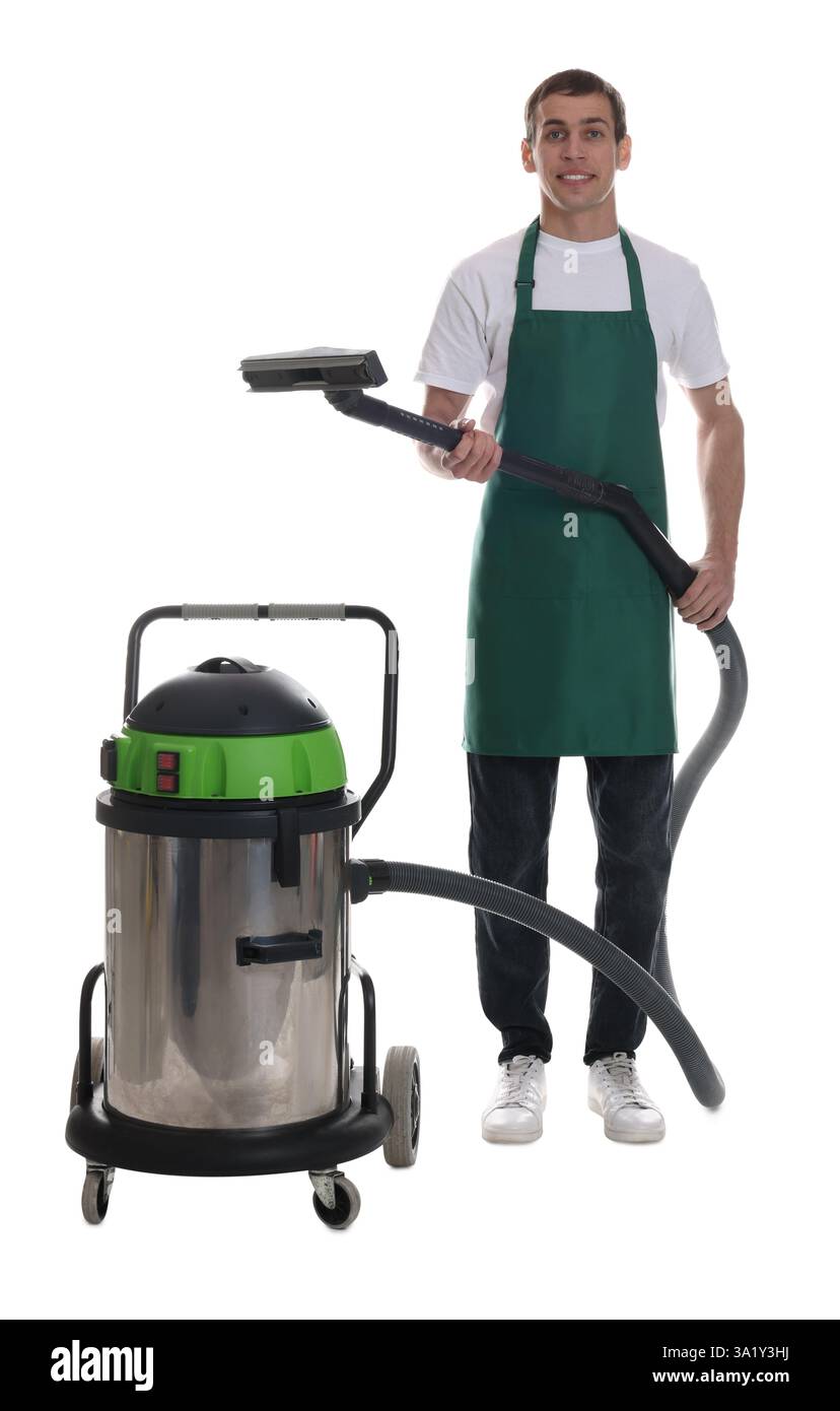 Smiling cleaning service worker with vacuum cleaner on white background ...