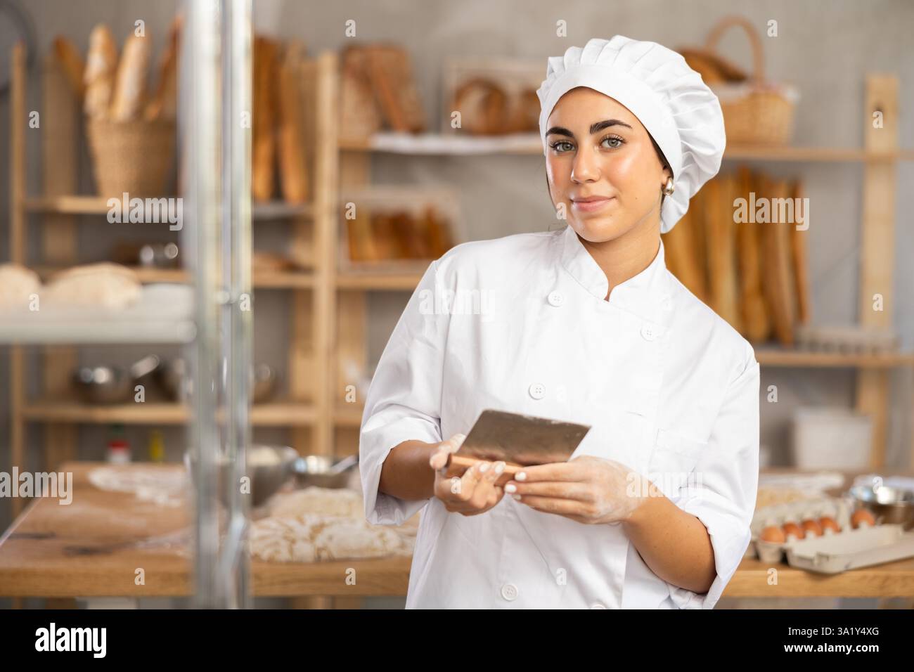 Young woman cutting slice dough hi-res stock photography and images - Alamy