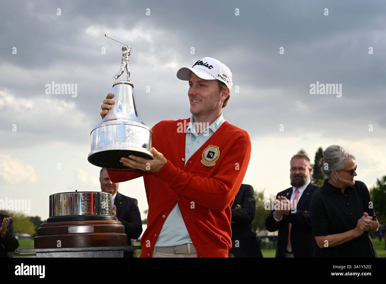 Russell Henley holds the championship trophy after winning the Arnold ...