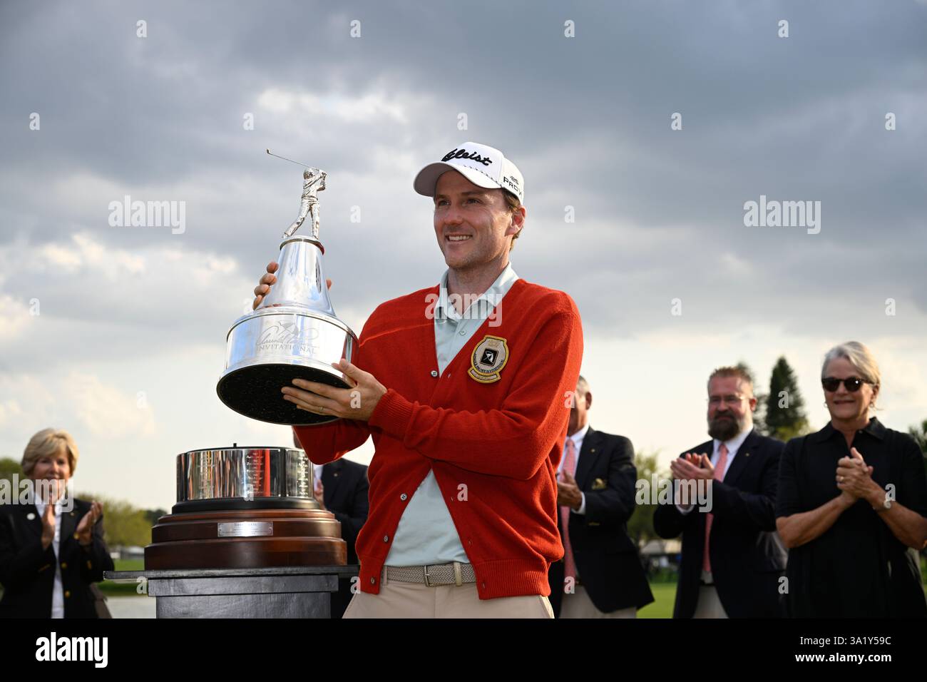 Russell Henley holds the championship trophy after winning the Arnold ...