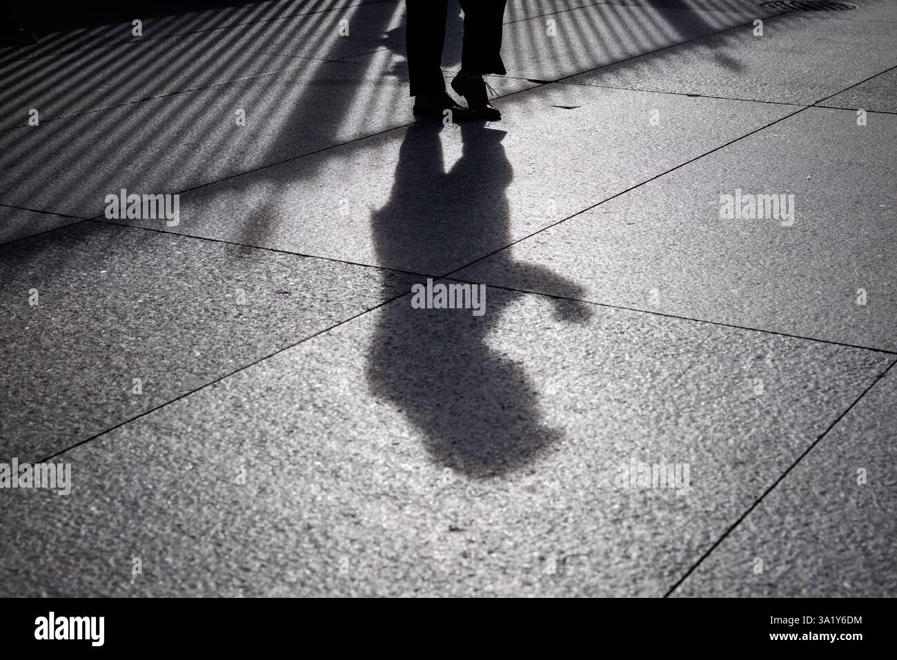 A street performer dances while wearing a mask of President Donald ...