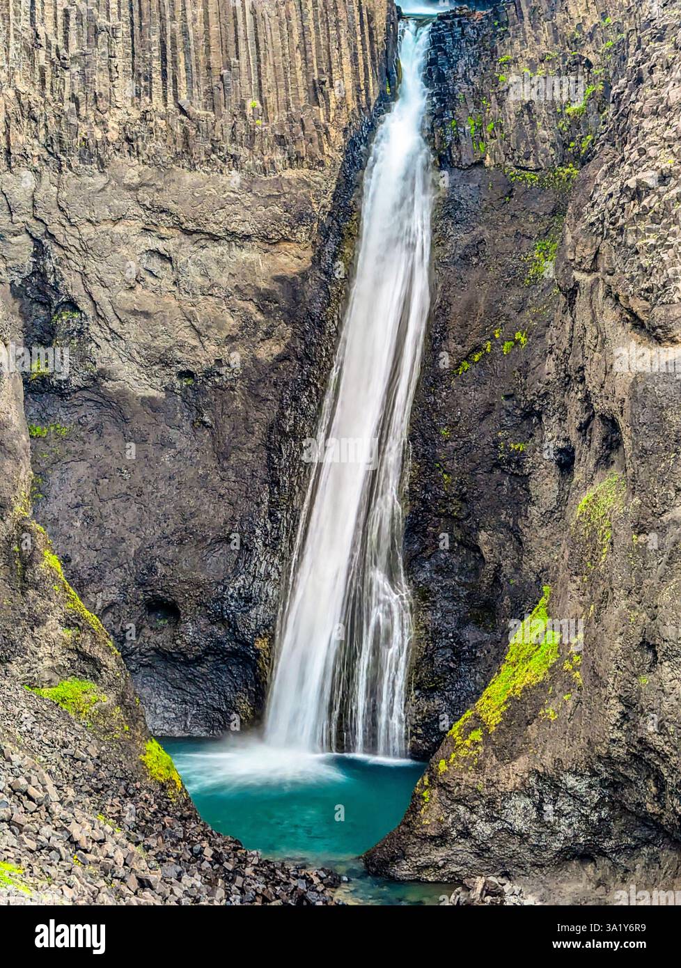 Aerial drone view of Hengifoss waterfall landscape in Iceland. Red ...