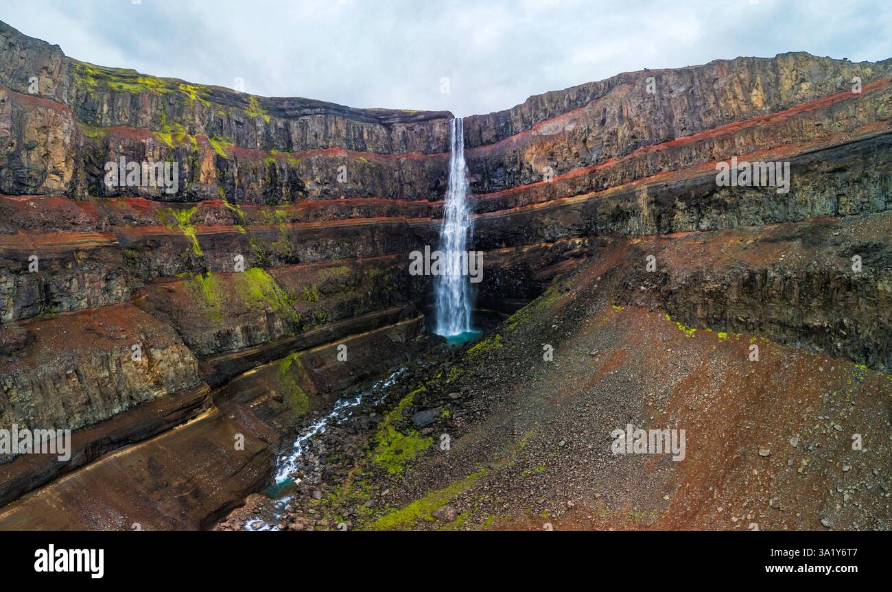 Aerial drone view of Hengifoss waterfall landscape in Iceland. Red ...