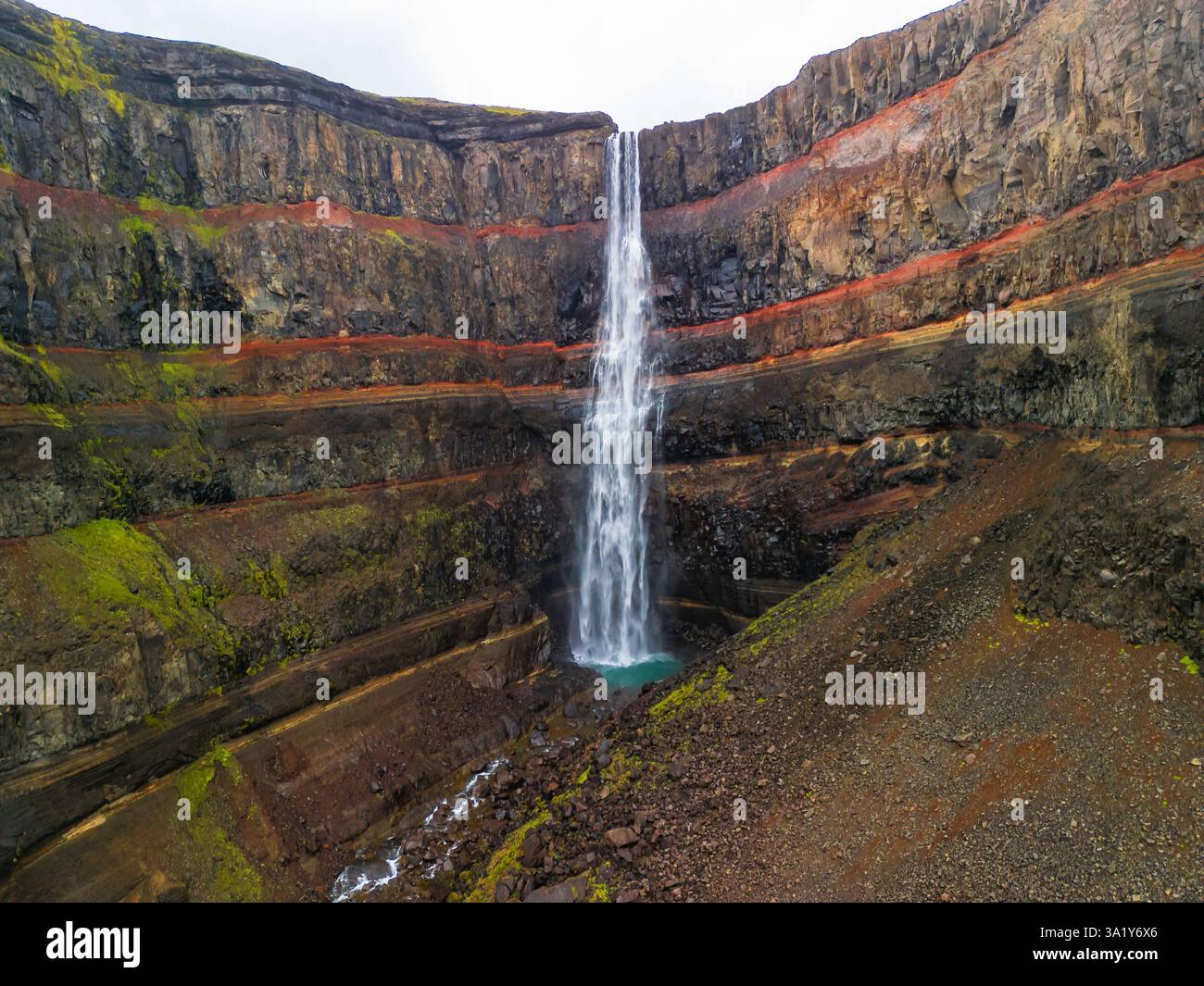 Aerial drone view of Hengifoss waterfall landscape in Iceland. Red ...