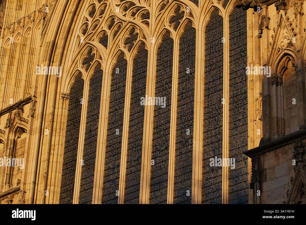 Close-up of Gothic architecture featuring a tall, arched window with ...