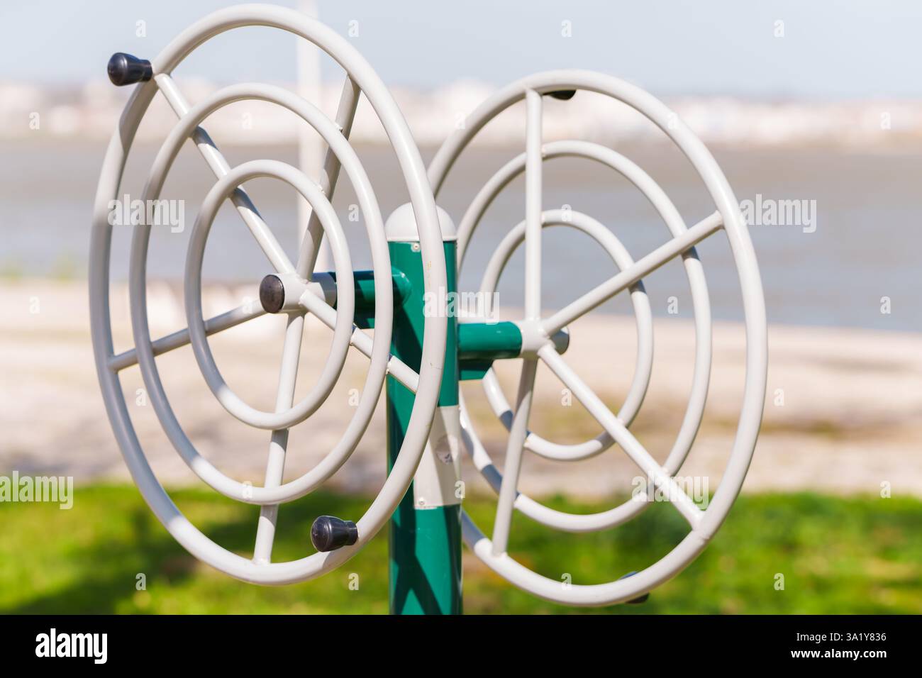 Public exercise machine with rotating wheels designed for upper body ...
