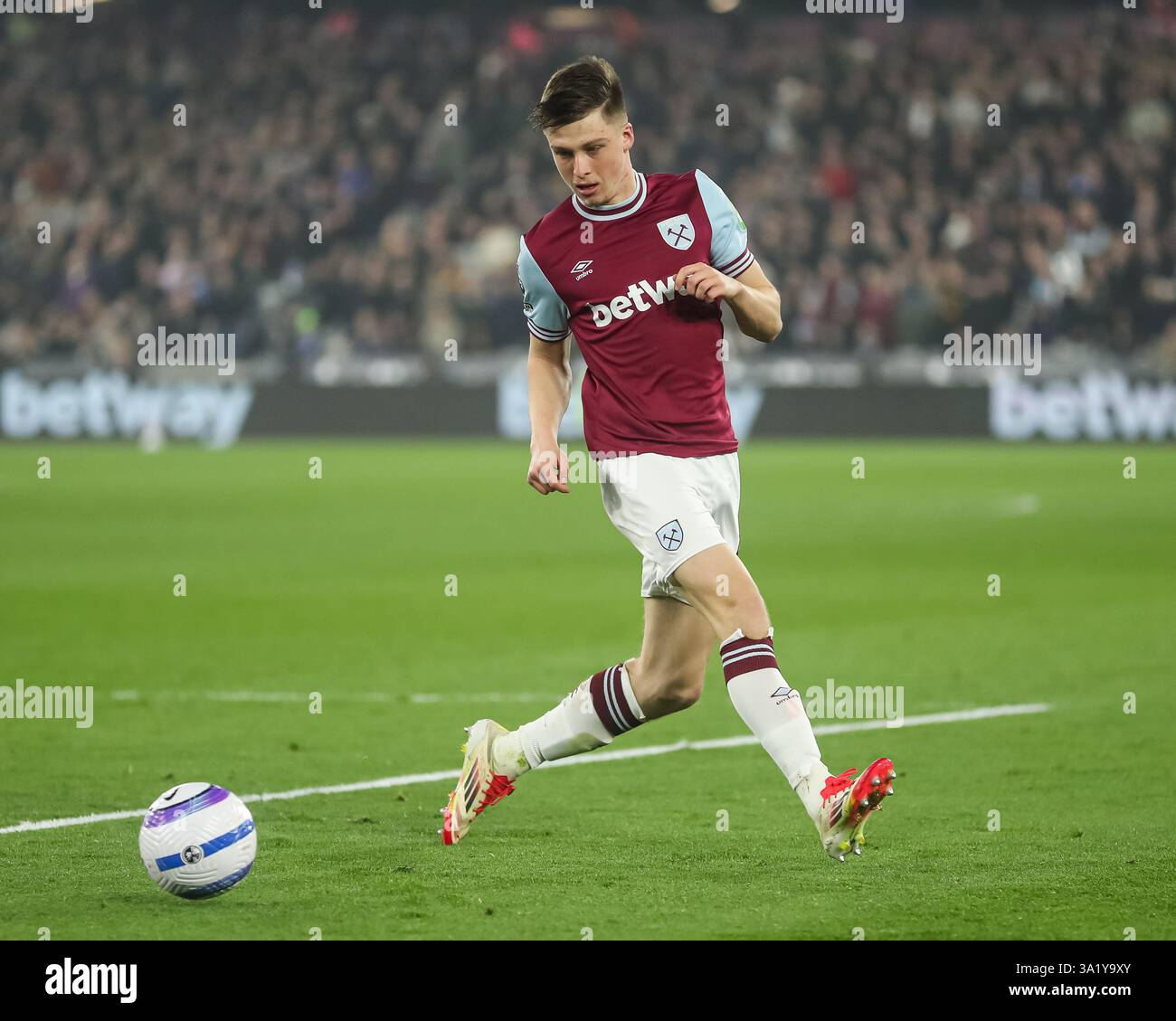 Oliver Scarles of West Ham United makes a break with the ball during ...