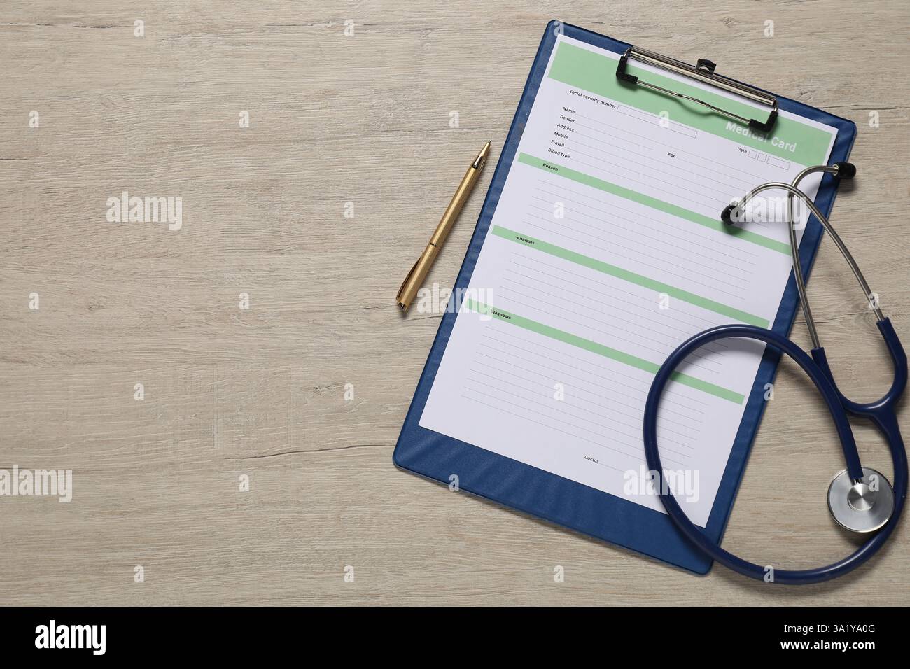 Medical card form, pen and stethoscope on light wooden background, top ...