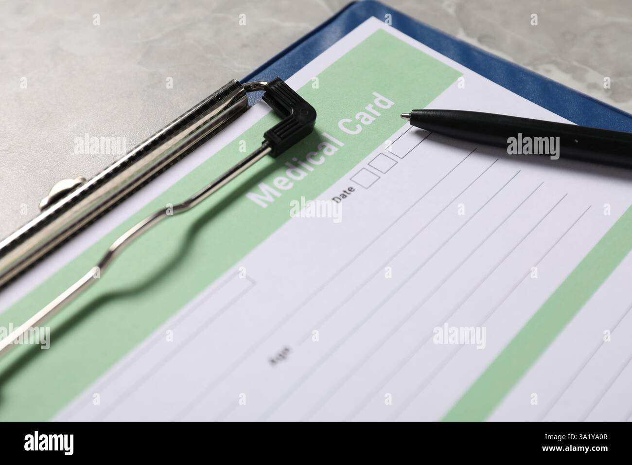 Medical card form and pen on grey background, closeup Stock Photo - Alamy