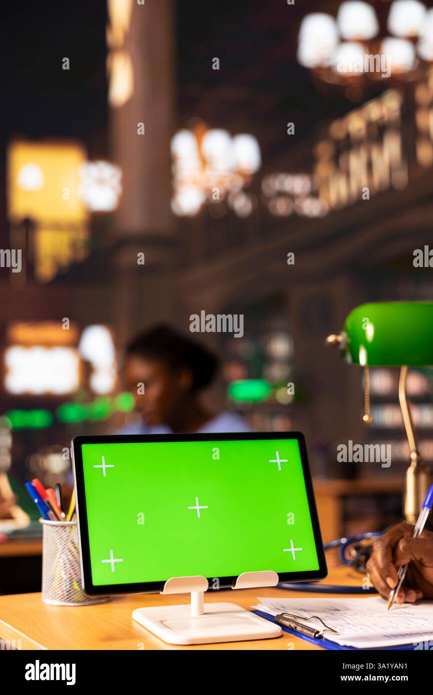 Future healthcare professional studying medical methods next to chroma ...