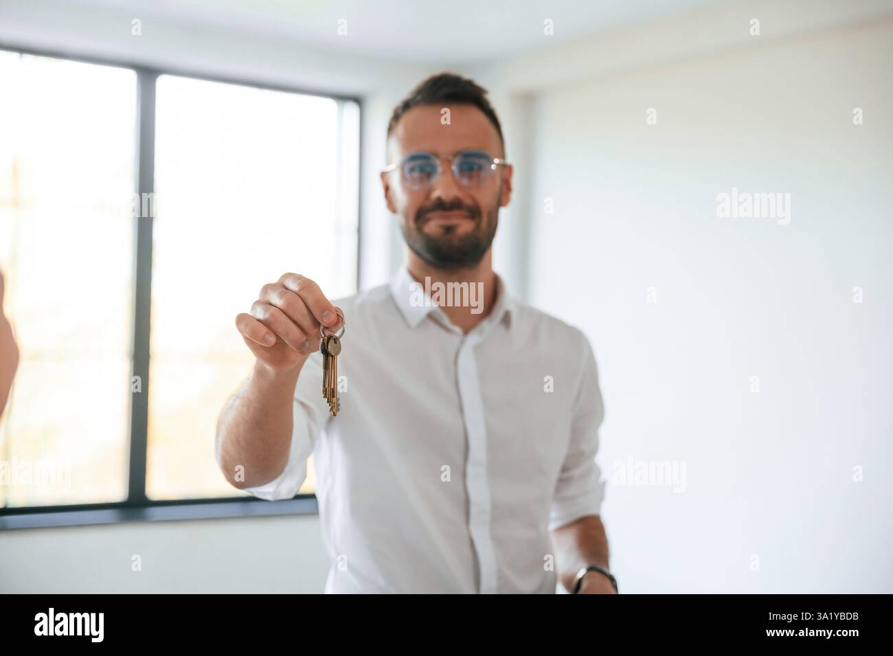 Man shows keys new apartment hi-res stock photography and images - Alamy