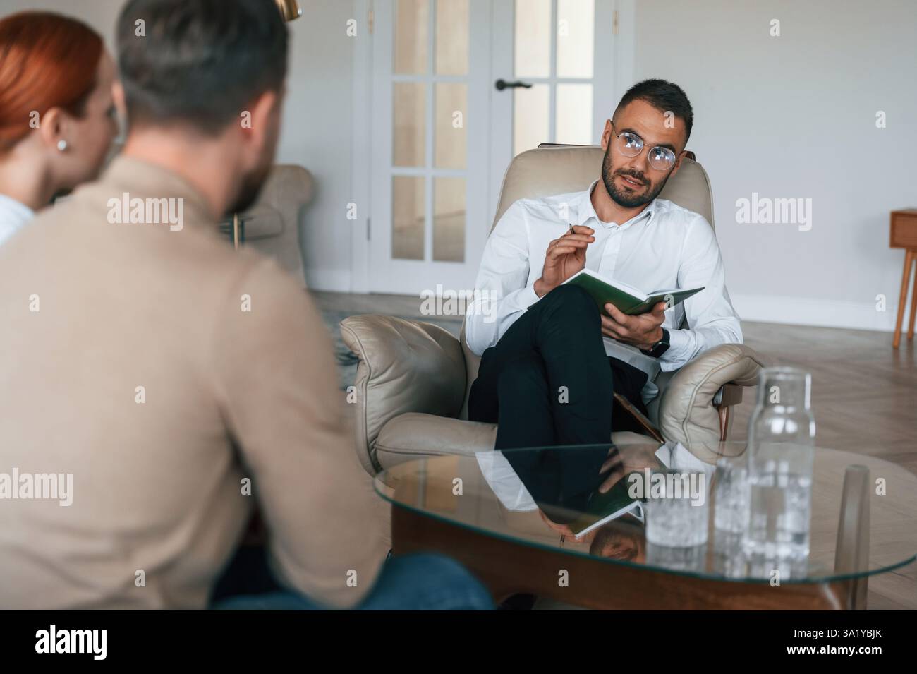 Couple at a psychologist's appointment Stock Photo - Alamy