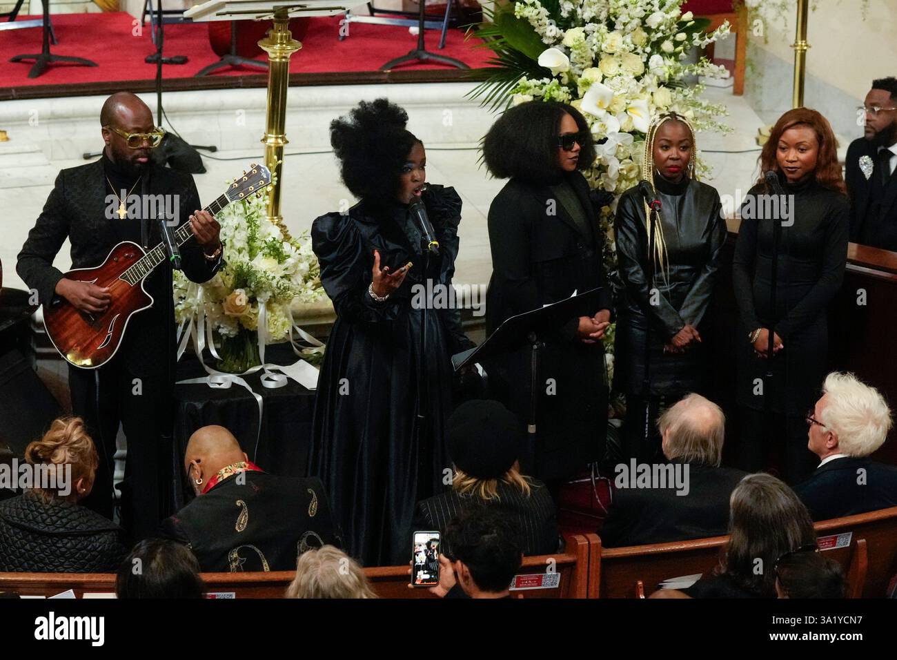 Wyclef Jean, left, and Lauryn Hill of the Fugees perform during a ...