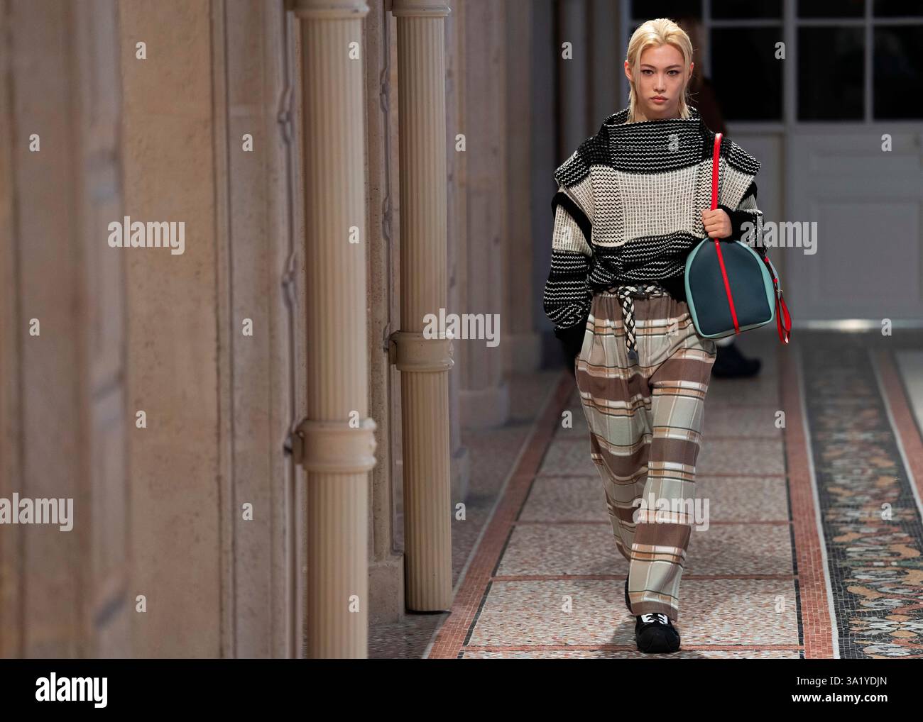Australian singer Felix, wears a creation as part of the Louis Vuitton ...