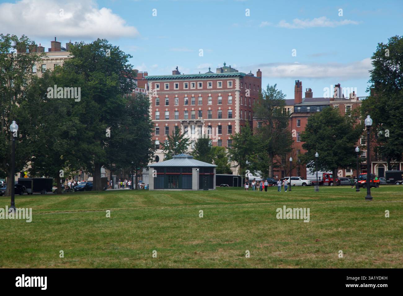 The People walking on Boston Common and the skyline of the city ...