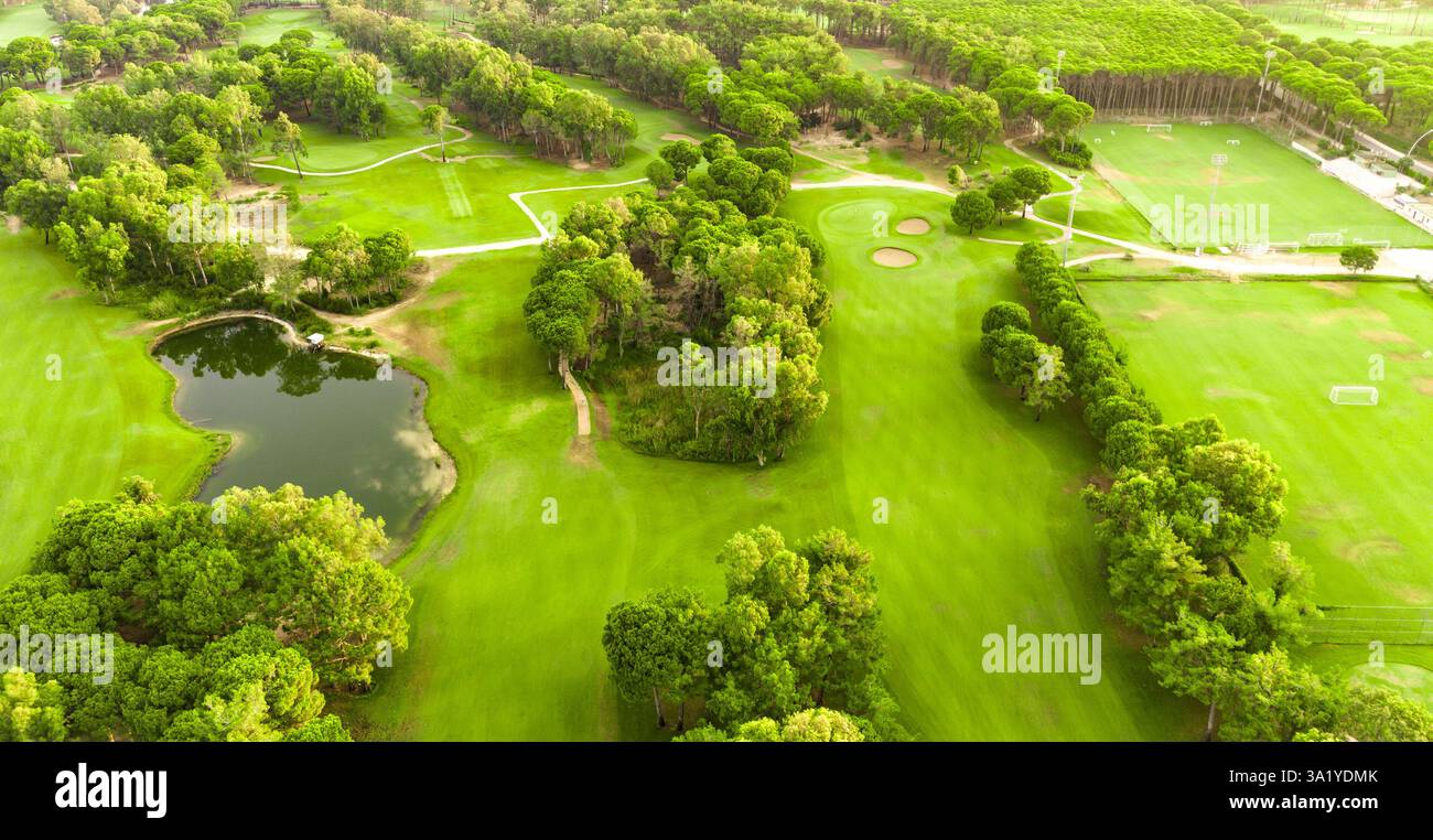 Aerial view of a golf course with water hazards, sand bunkers, and ...