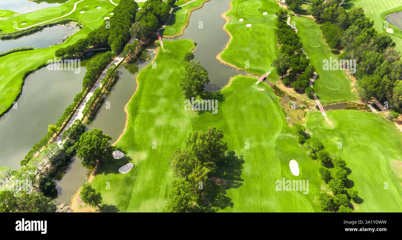 Aerial view of a golf course with water hazards, fairways, sand bunkers ...