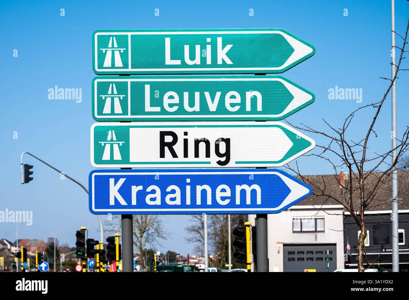 Traffic signs to the E 40 highway, the ringroad and the village of ...