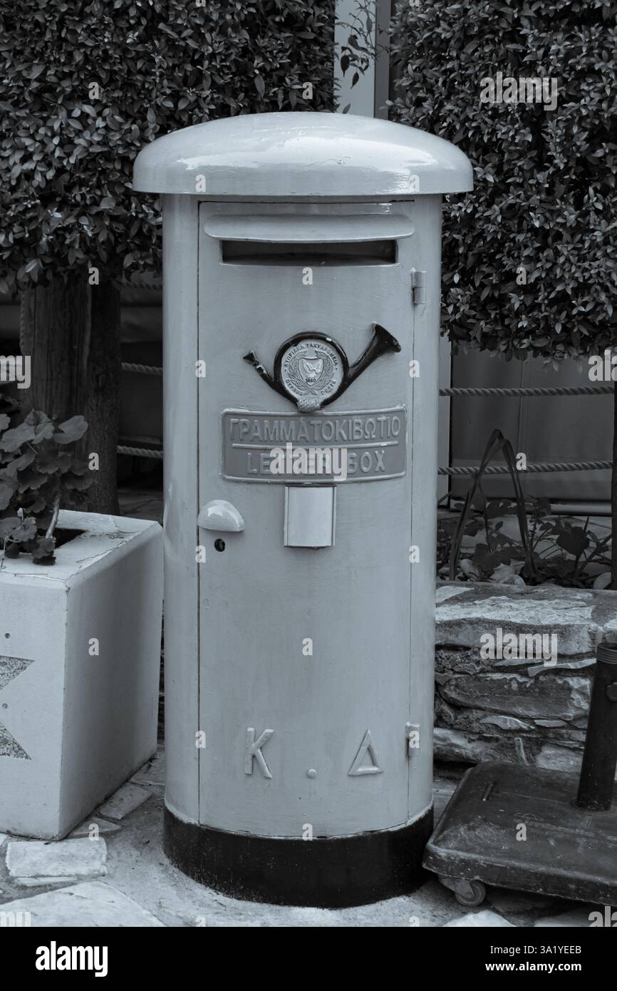 Classic Cypriot post box used for sending letter mail in black and ...
