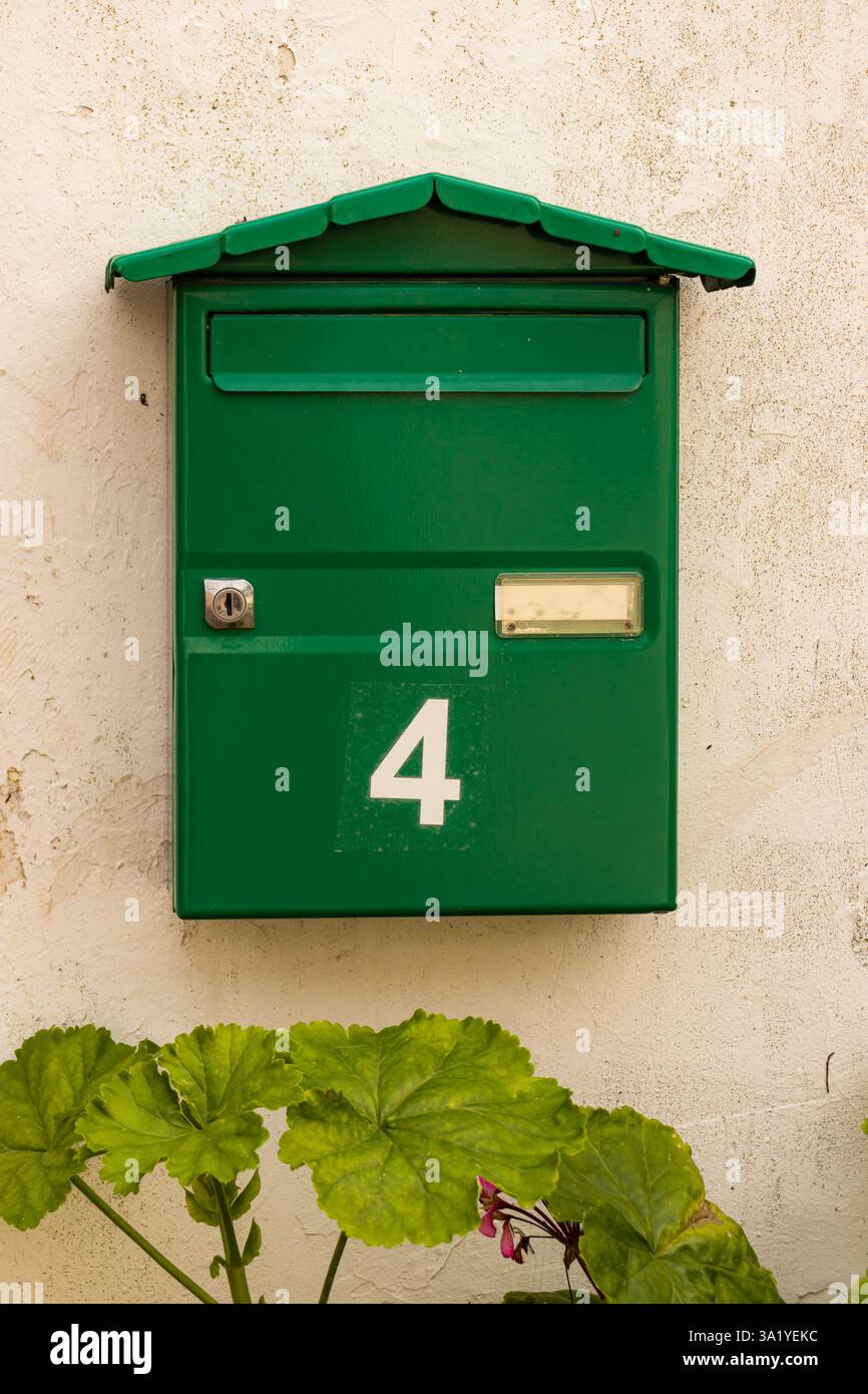House number 4 (four) on mail box Stock Photo - Alamy