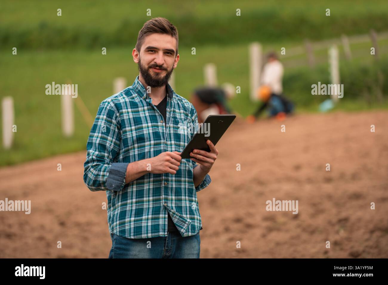Male farmer plantation checking quality by tablet agriculture modern ...