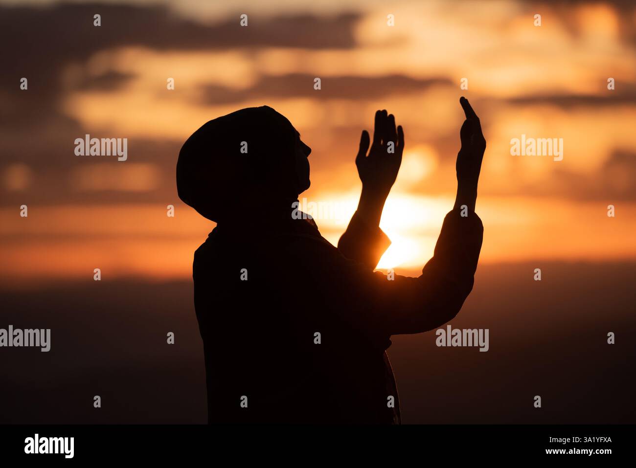 Muslim woman prayer praying with hands up open doing dua worship Allah ...