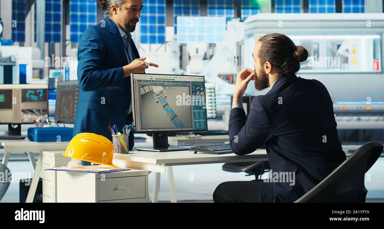 Engineer in photovoltaics factory talking with coworker, diagnosing ...