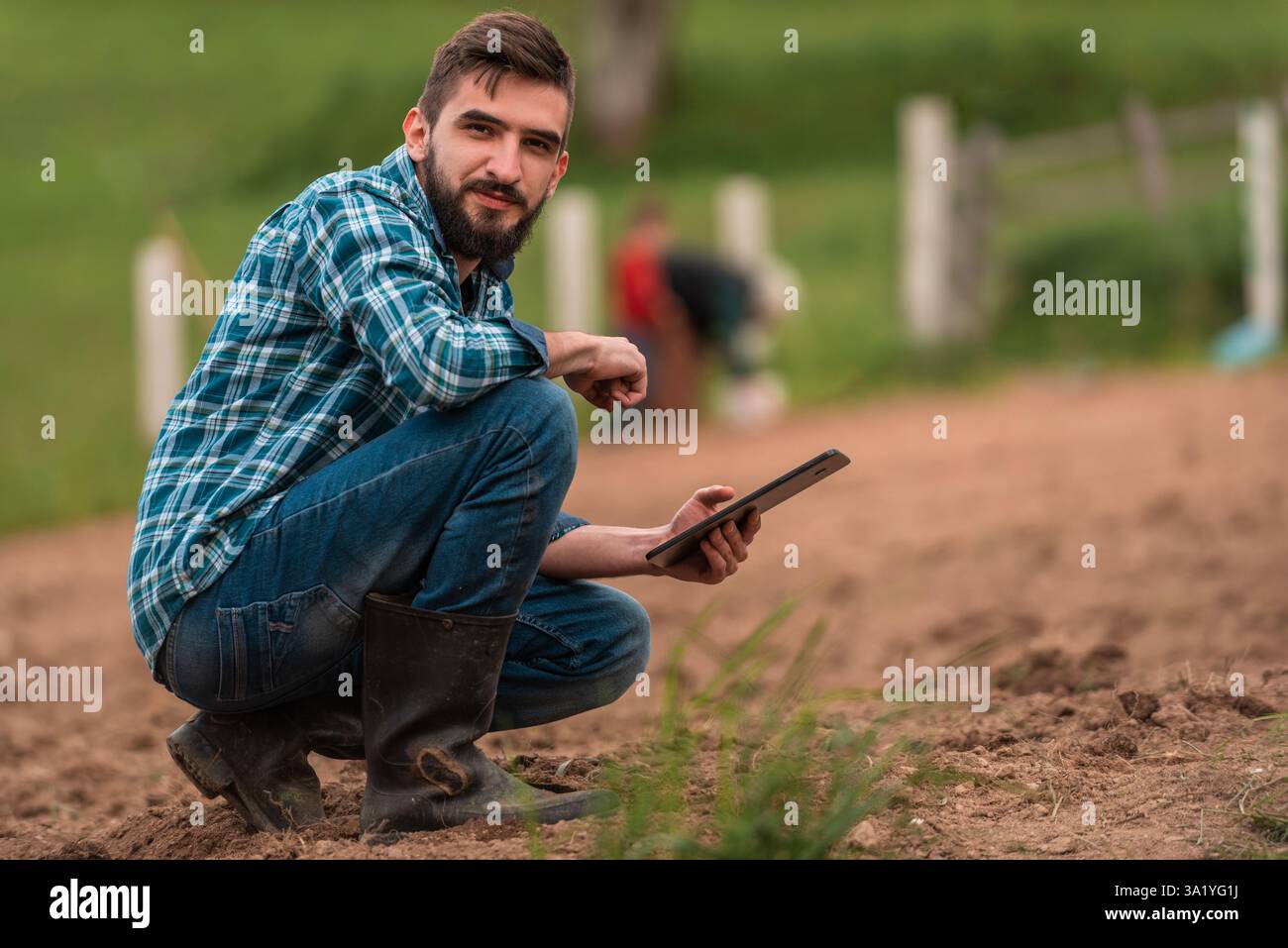 Male farmer plantation checking quality by tablet agriculture modern ...