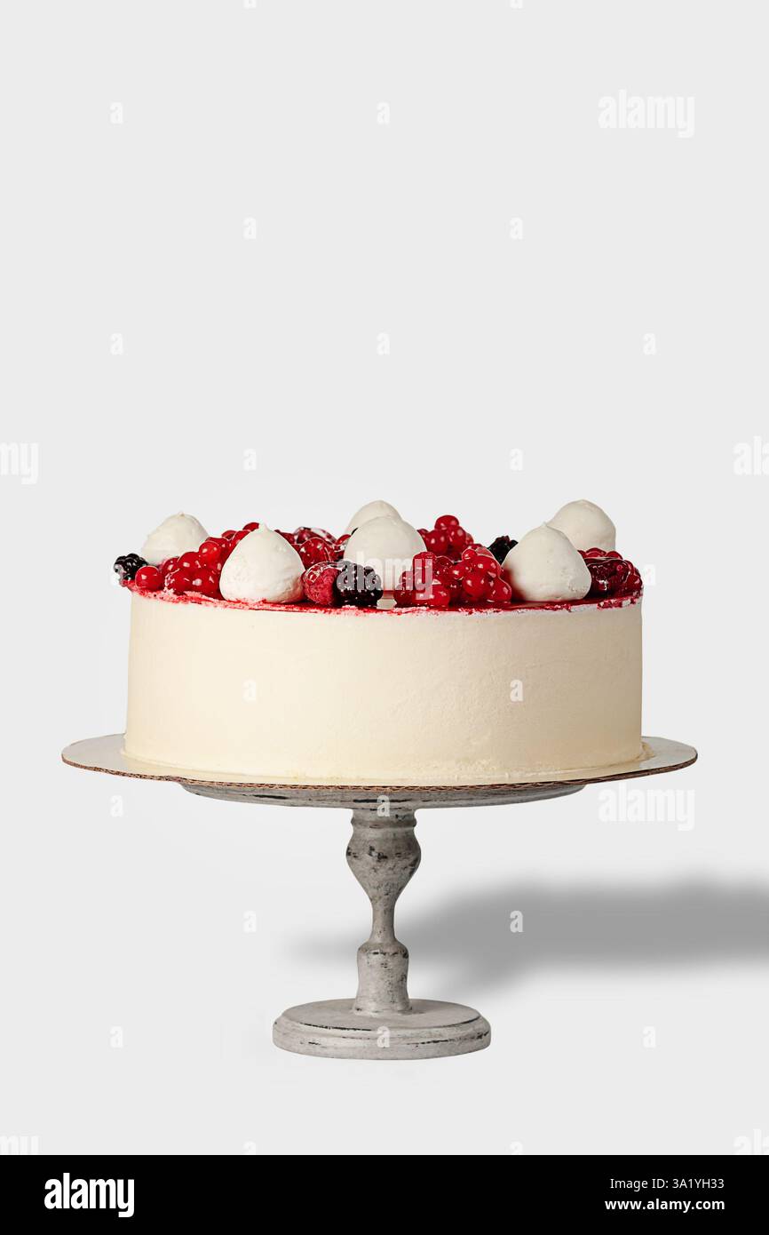 Bright, beautiful red berry cake lying on a cake stand. Isolated image ...