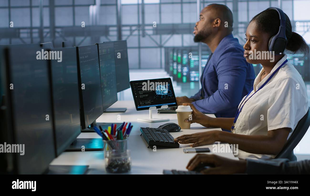 Admin in data center drinking coffee and implementing AI predictive maintenance systems. Server ...