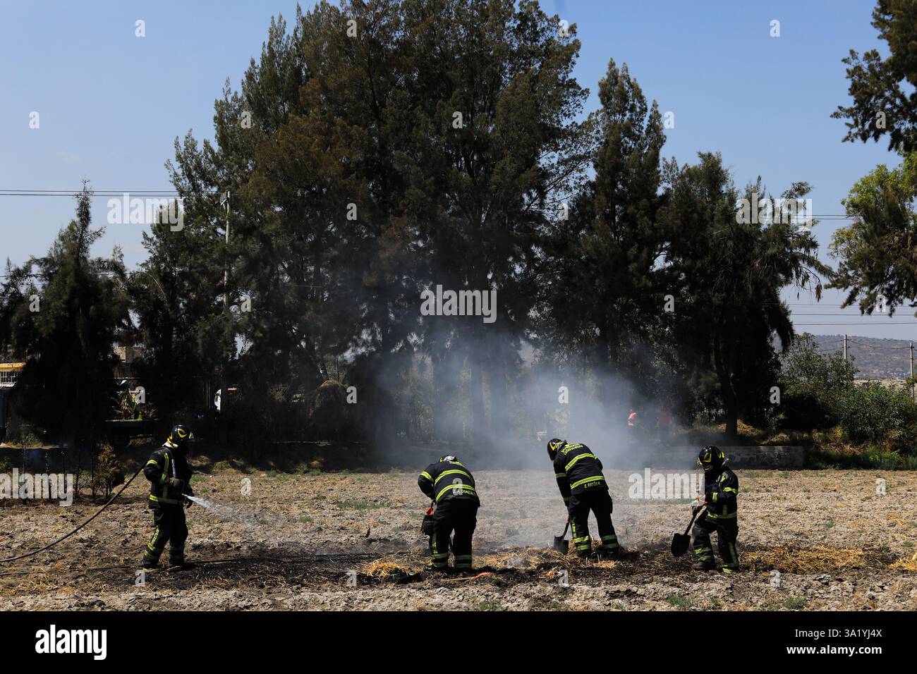 Members of the Mexico City Fire Department extinguishes a fire during a ...