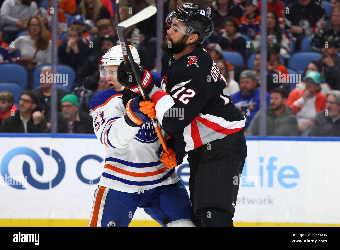 Edmonton Oilers defenseman Troy Stecher (51) and Buffalo Sabres left ...