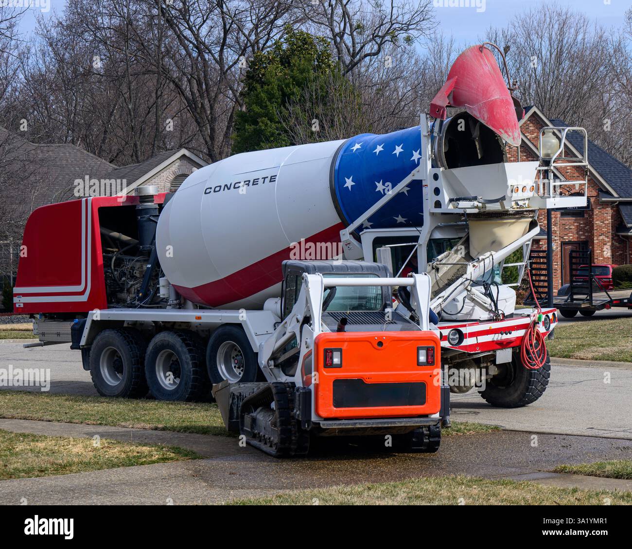 Loading concrete from mixer truck to front loader vehicle Stock Photo ...