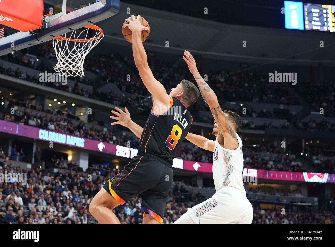 Phoenix Suns guard Grayson Allen (8) drives past Denver Nuggets forward ...
