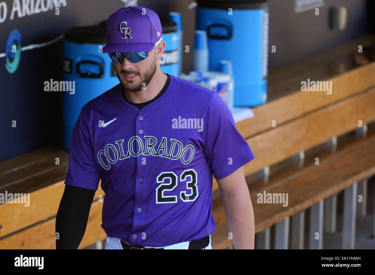 Colorado Rockies' Kris Bryant walks through the dugout prior to a ...