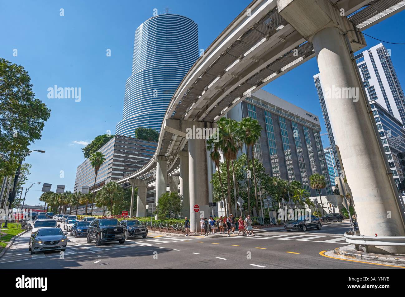 Miami, Florida, USA – February 28, 2025: Downtown with traffic, people, and the elevated ...