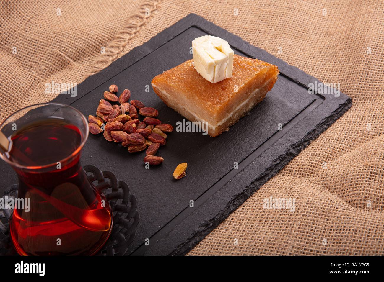 dessert of baked bread dough soaked in sugar syrup, served with fresh ...