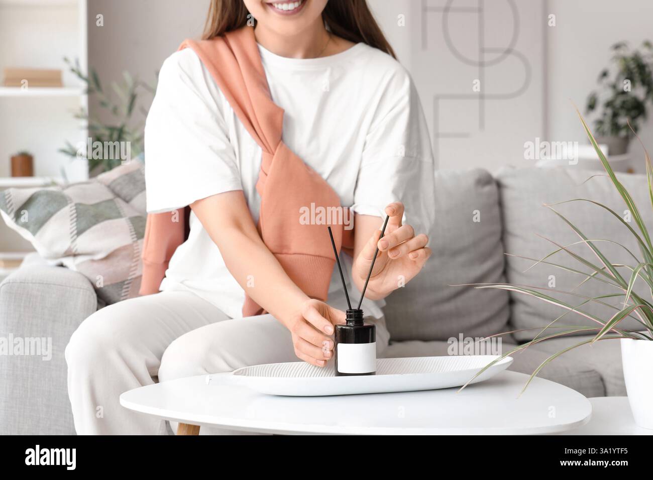 Woman air reed diffuser on hi-res stock photography and images - Alamy