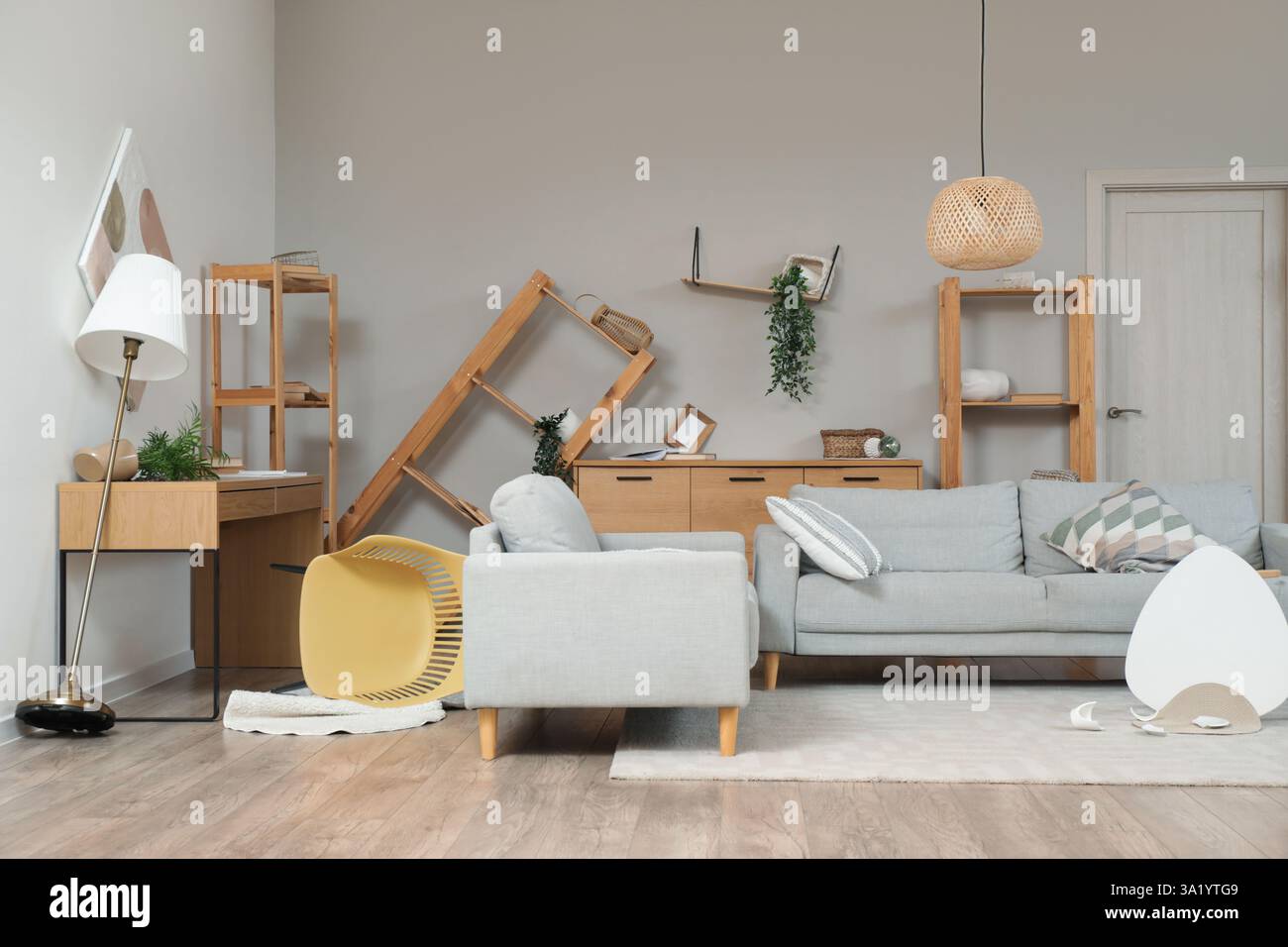 Interior of messy living room with overturned furniture after ...