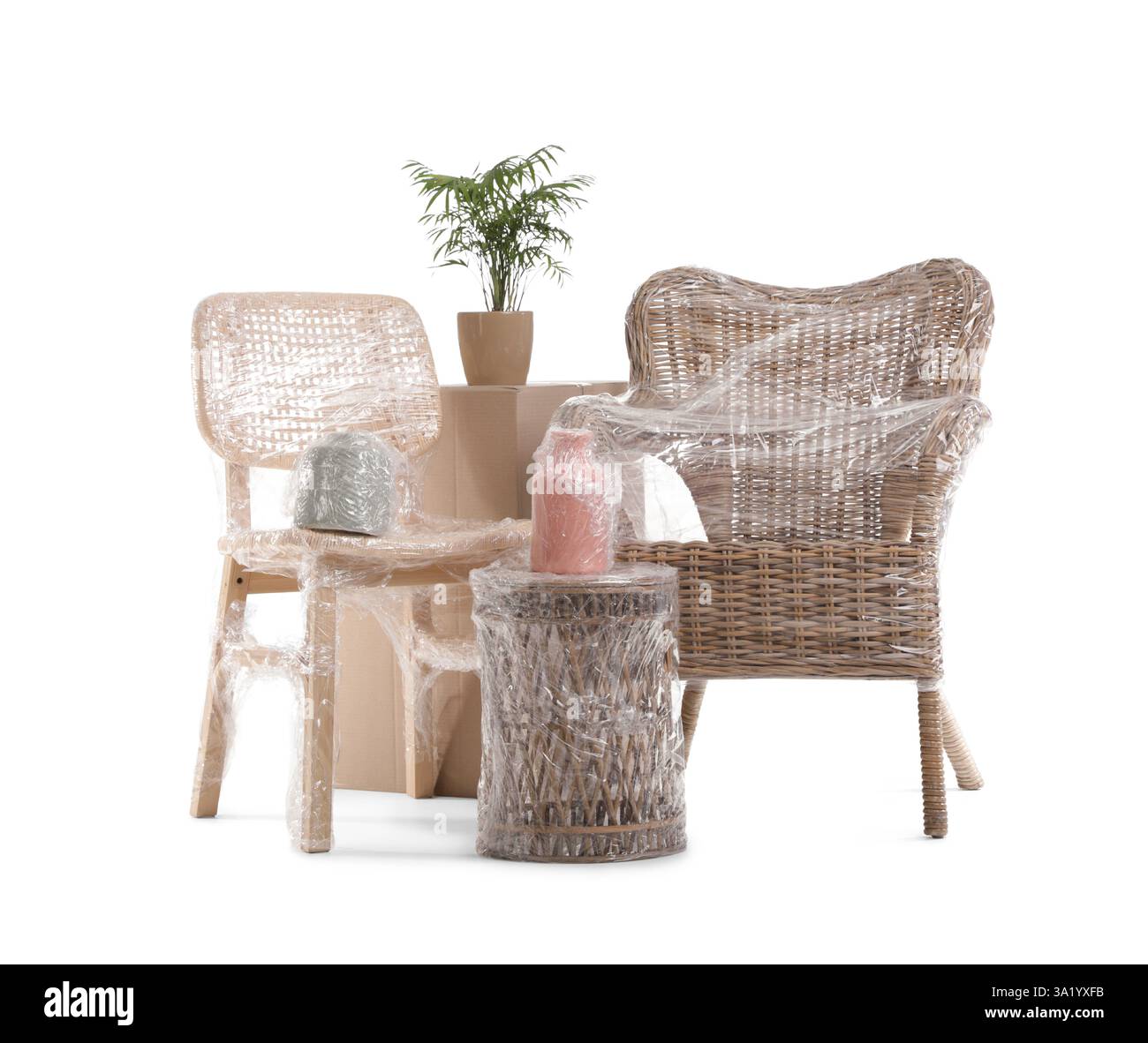 Chairs with things wrapped in stretch film and moving box on white ...