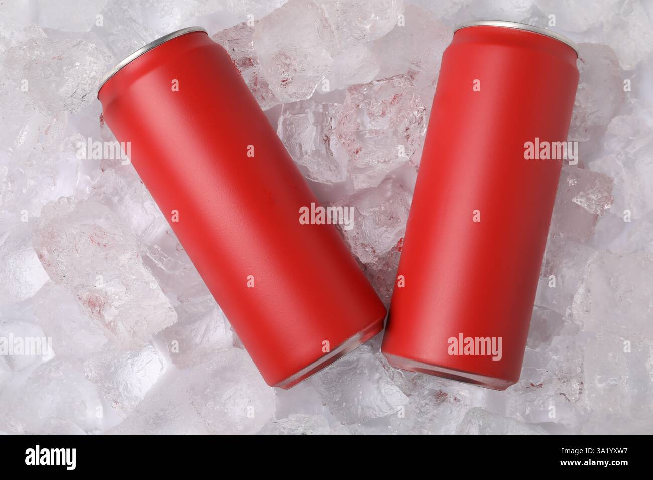 Refreshing drinks in cans on ice cubes, top view Stock Photo - Alamy