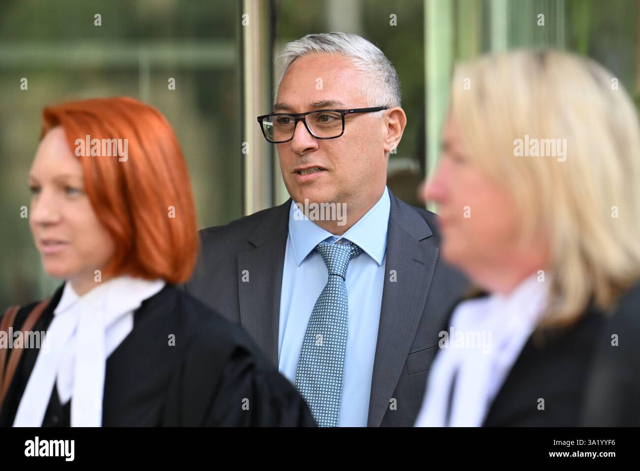 Melbourne, Australia. 11th Mar, 2025. Robert Italiano departs (centre ...