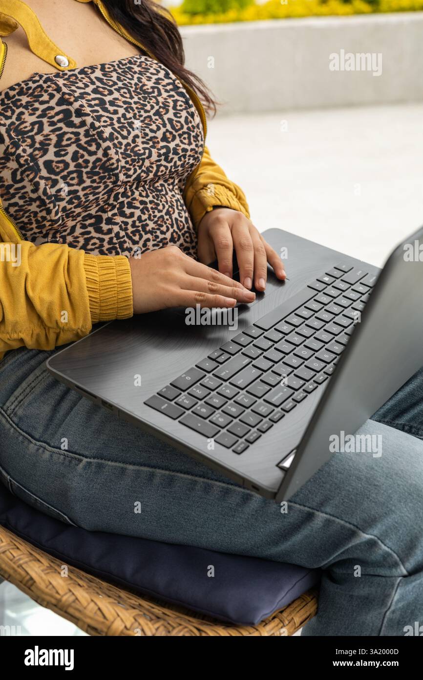 A quiet, haunting moment as a girl studies on her laptop, sipping hot ...